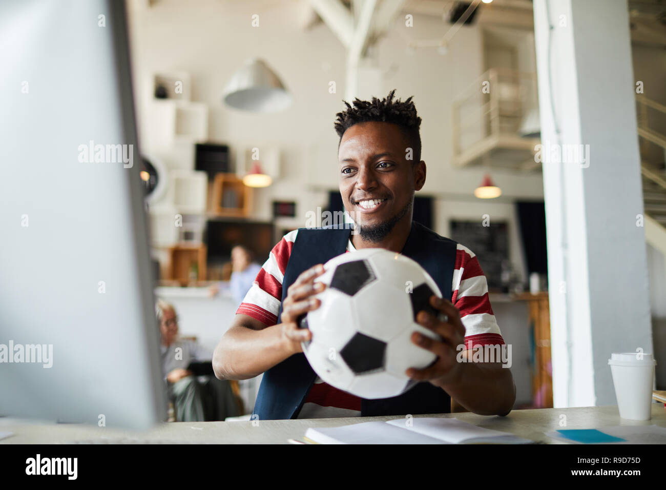 Fan with soccer ball Stock Photo - Alamy