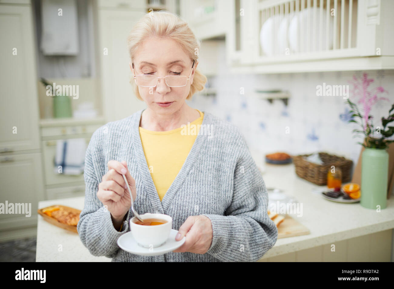 Having hot tea Stock Photo - Alamy