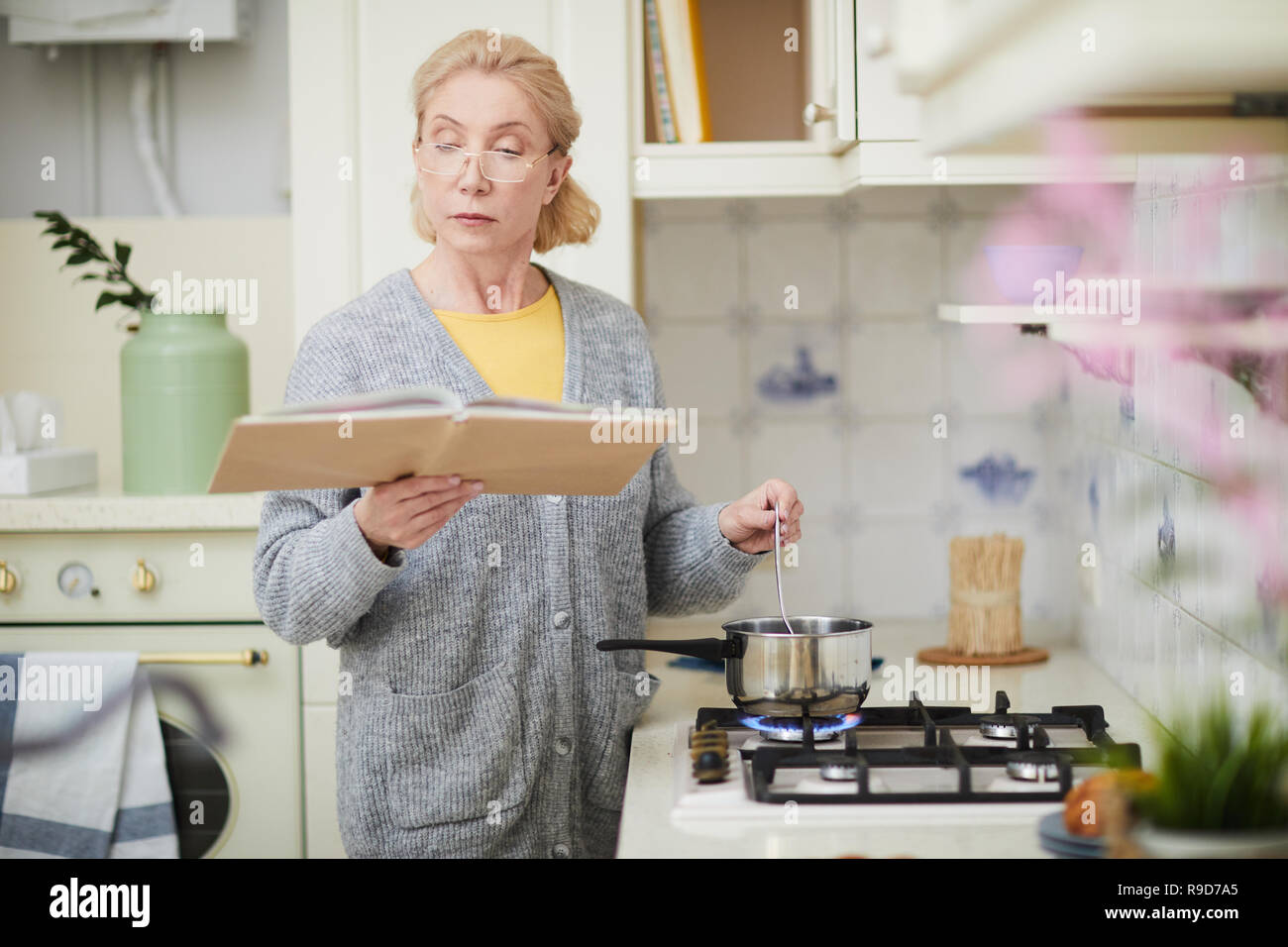 Cooking in the kitchen Stock Photo - Alamy
