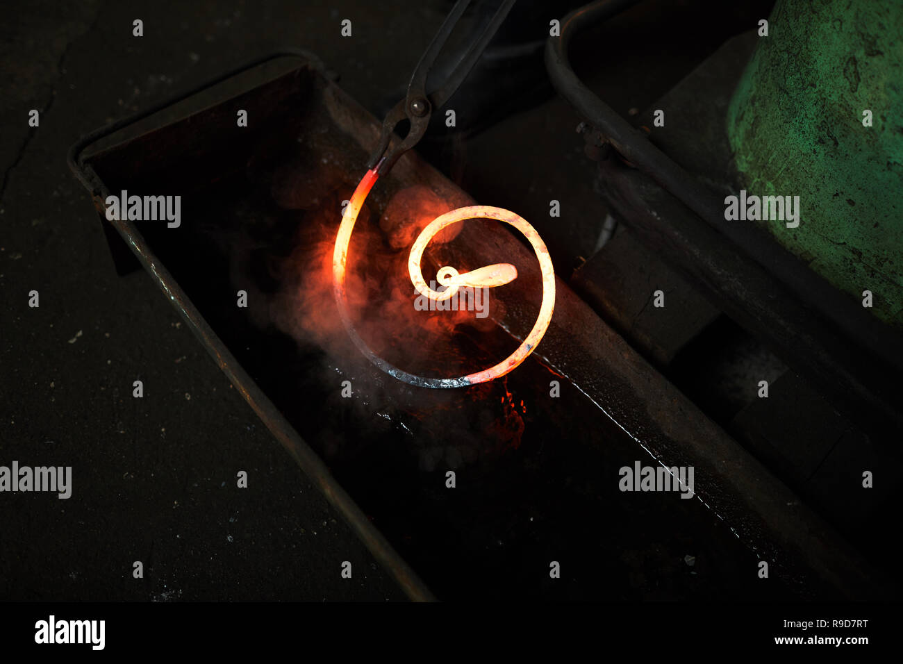 Hot workpiece in water Stock Photo - Alamy