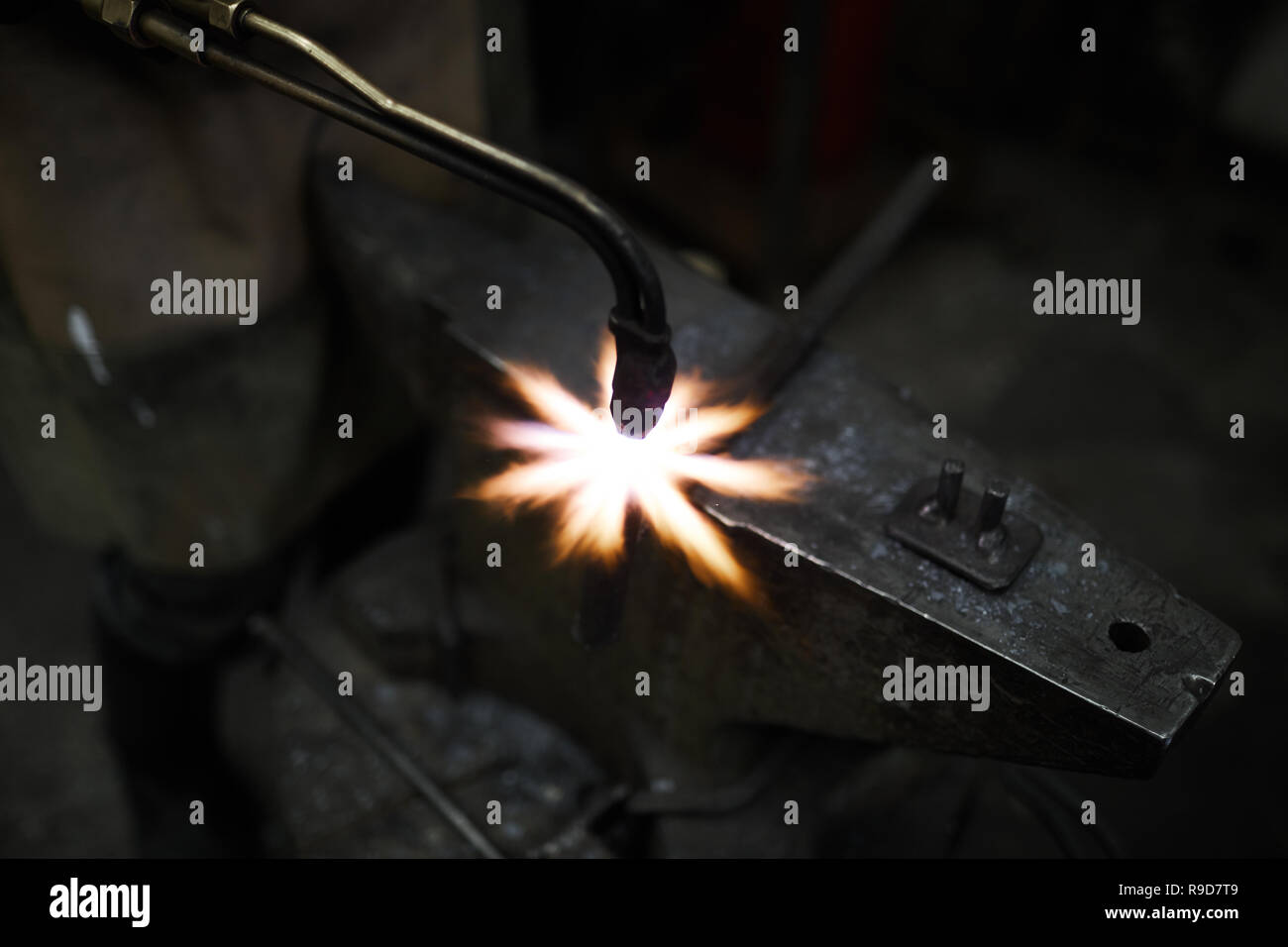 Welding on anvil Stock Photo - Alamy