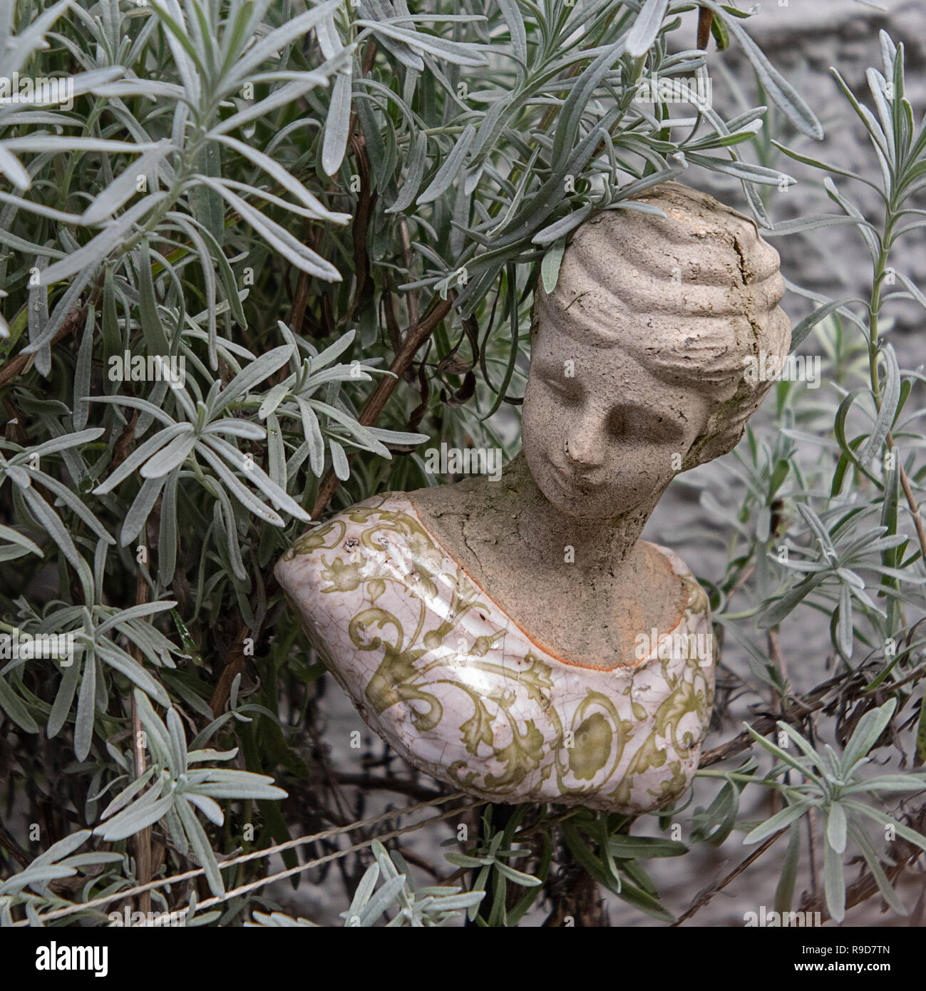 figure of stone in a garden child angel Stock Photo - Alamy