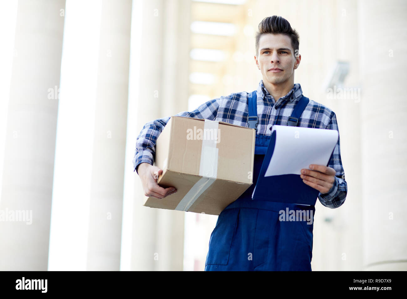 Person with package hi-res stock photography and images - Alamy