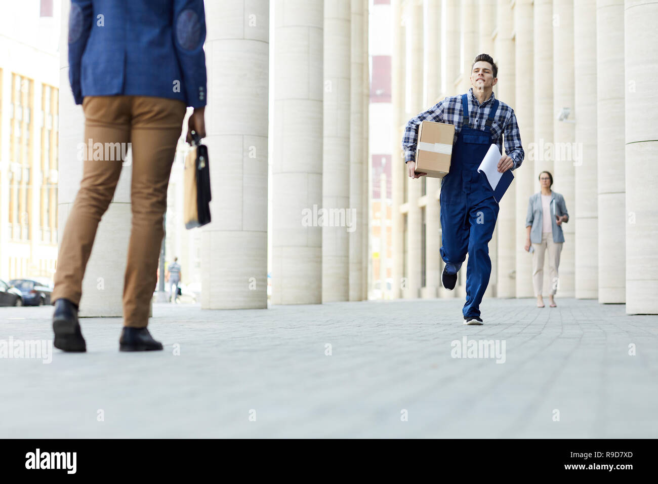 Person with package hi-res stock photography and images - Alamy