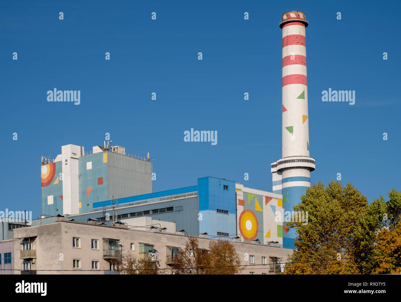 Painted geometric forms pasted on smokestacks on the power plant in the ...