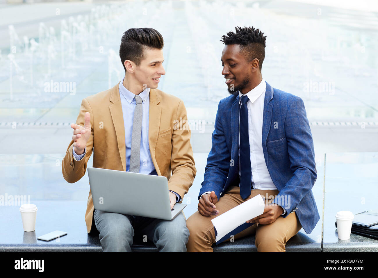 Men discussing ideas Stock Photo - Alamy