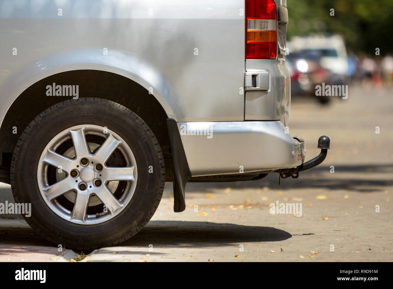 Close-up side view detail of silver passenger medium size luxury ...