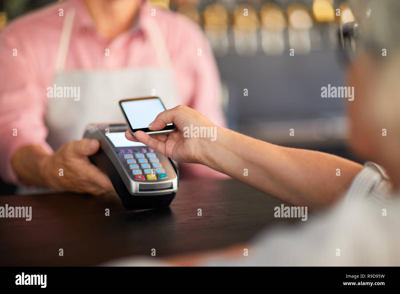 Paying after lunch Stock Photo - Alamy