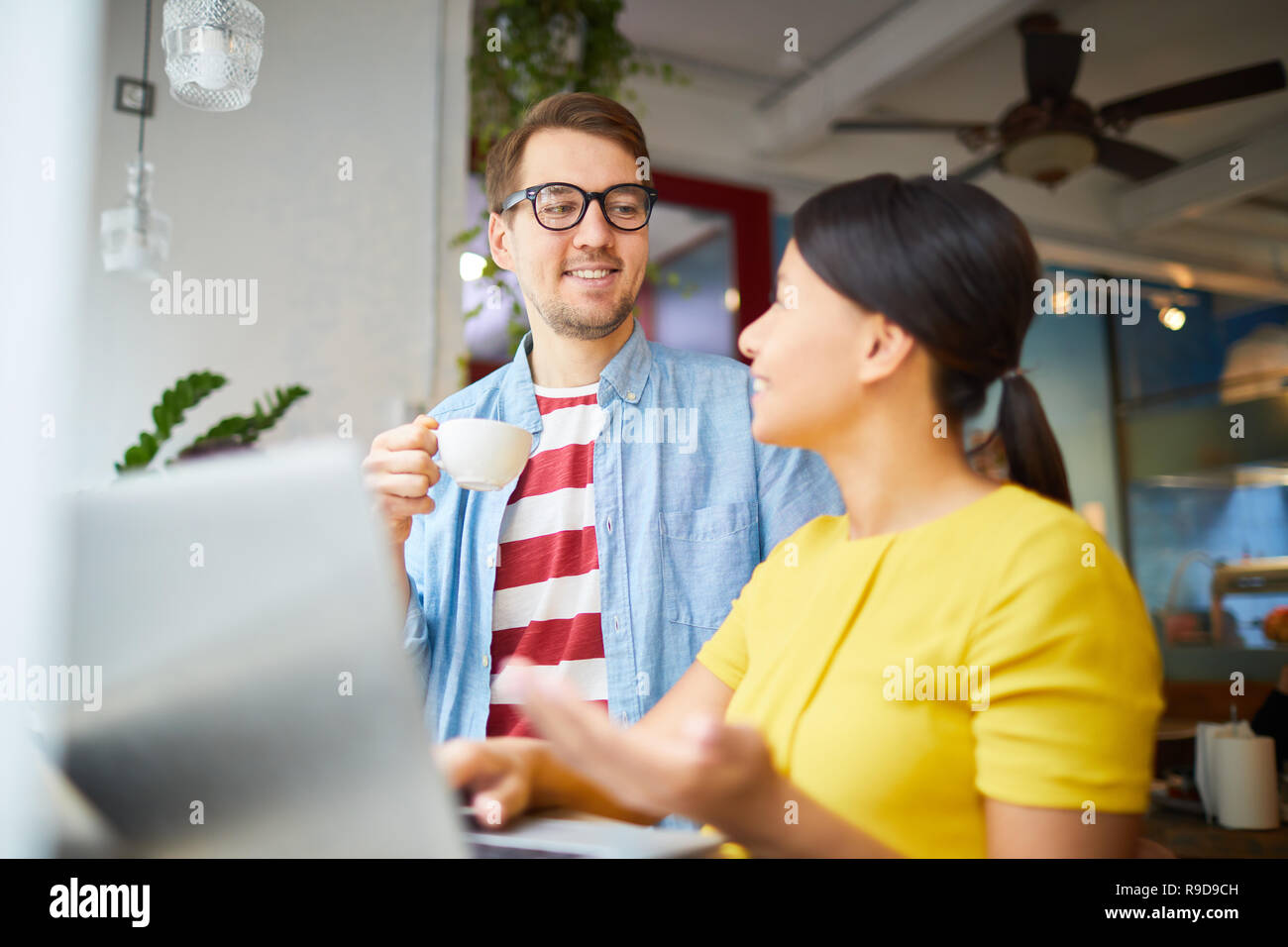 Colleagues talking in cafe Stock Photo - Alamy