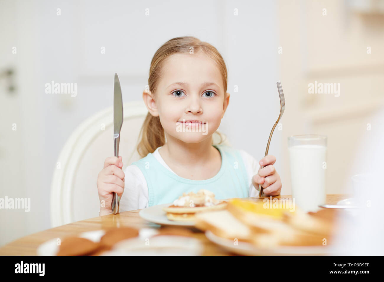 Content kid ready to eat Stock Photo - Alamy