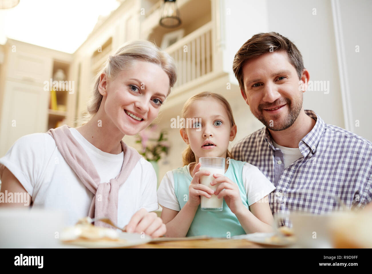Shocked daughter with parents Stock Photo - Alamy