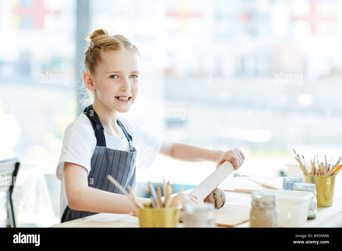 Girl at lesson of crafts Stock Photo - Alamy