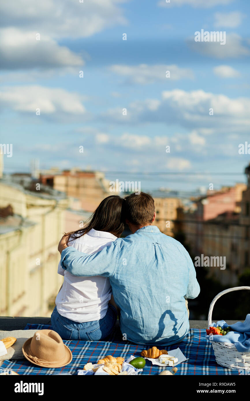 Couple at picnic on roof Stock Photo - Alamy