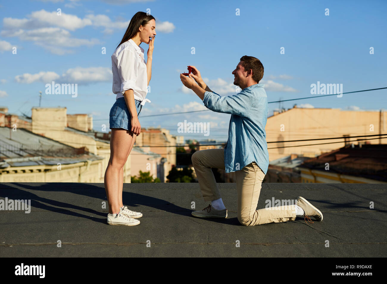 Excited girl surprised with marriage proposal Stock Photo - Alamy