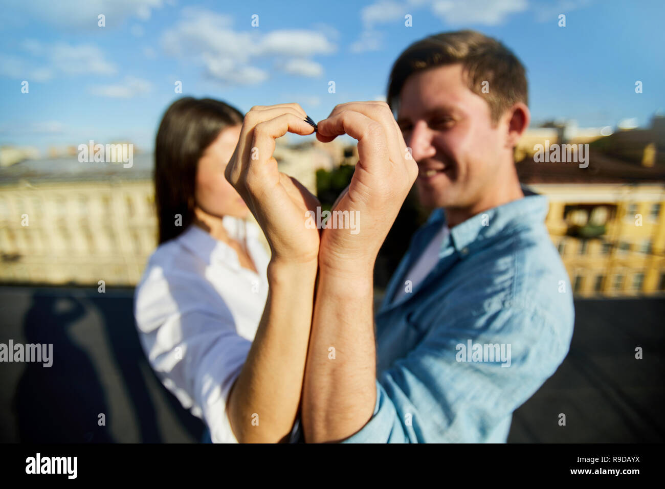 Making heart symbol with hands Stock Photo - Alamy
