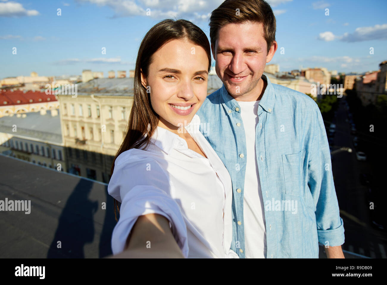 Selfie of beautiful couple on roof Stock Photo - Alamy