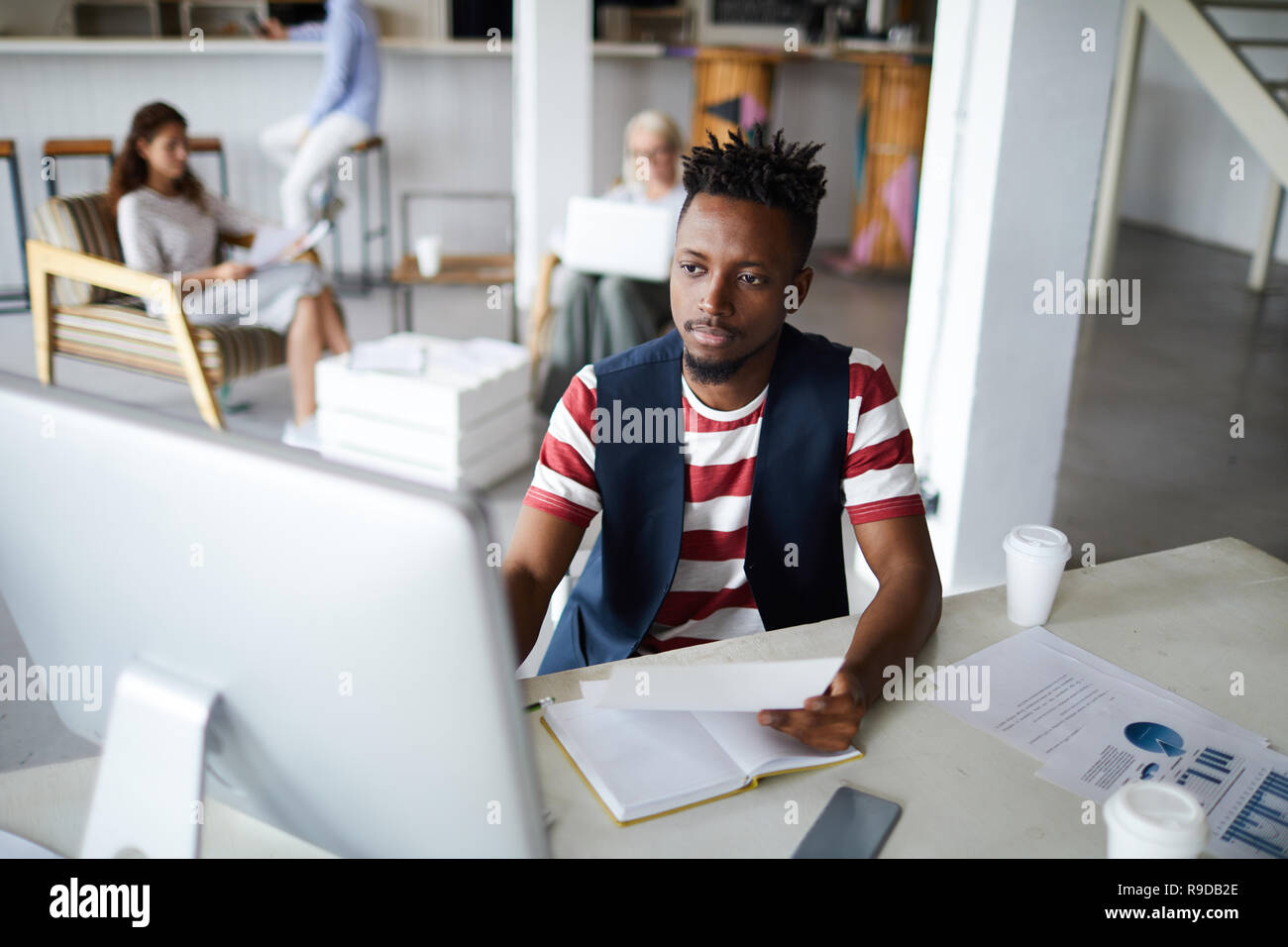 Young economist working Stock Photo - Alamy