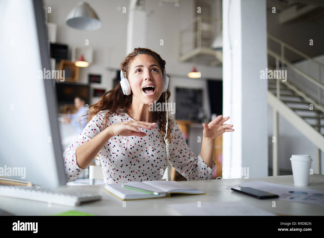 Singing at work Stock Photo - Alamy