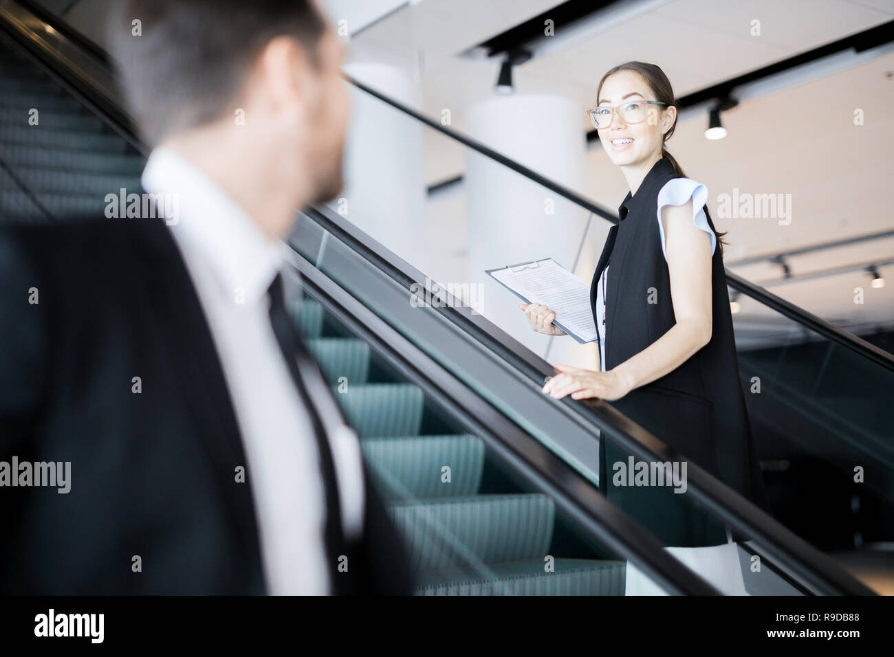 Moving on escalator Stock Photo - Alamy