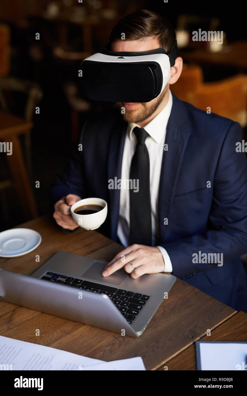 Businessman using interactive simulator for work Stock Photo - Alamy
