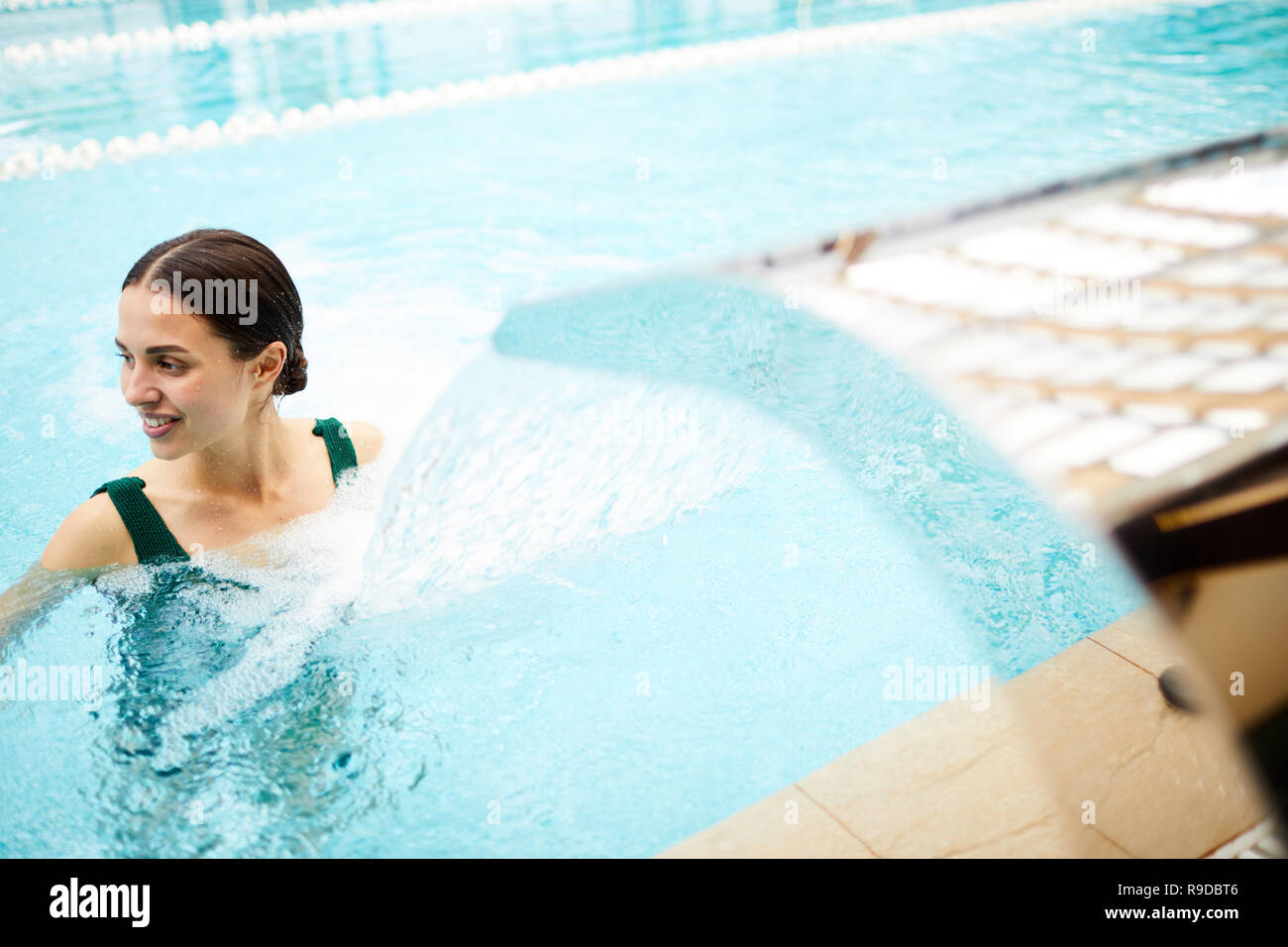 Woman spa waterfall pool hi-res stock photography and images - Alamy