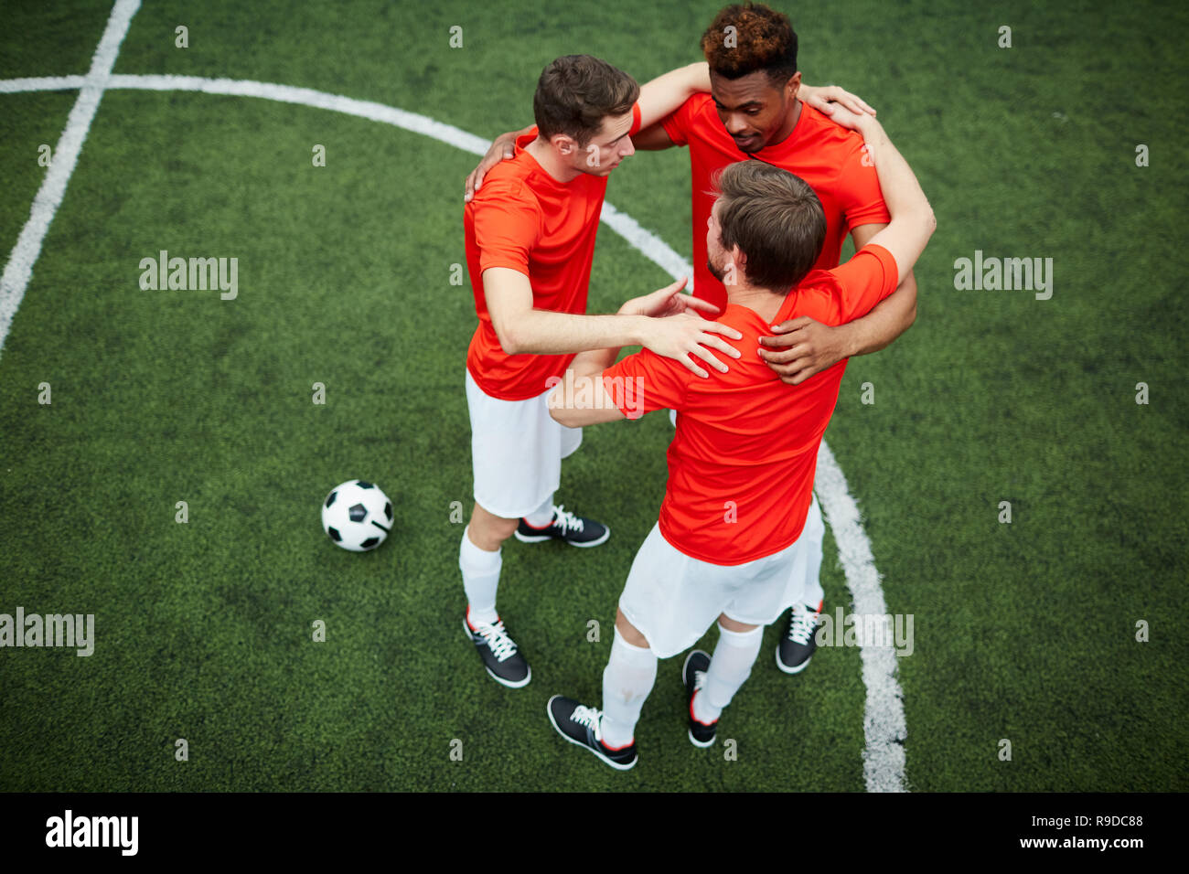 Circle of footballers Stock Photo - Alamy