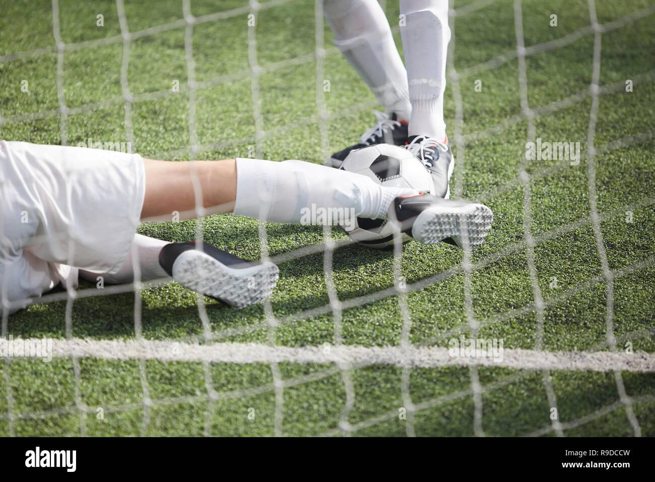 Footballer kicking net hi-res stock photography and images - Alamy