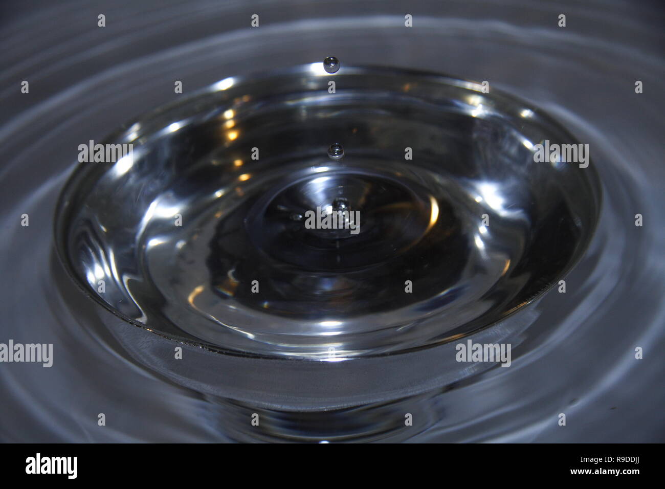 Water droplet hitting water surface Stock Photo - Alamy