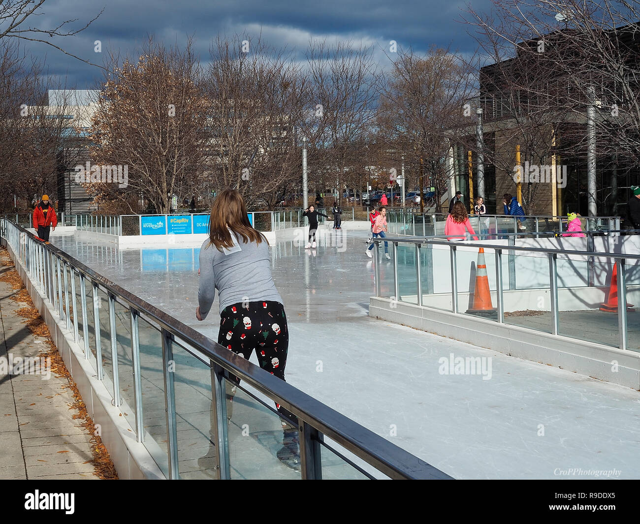 Adults and kids at outdoors skating rink in Capitol Riverfront in ...