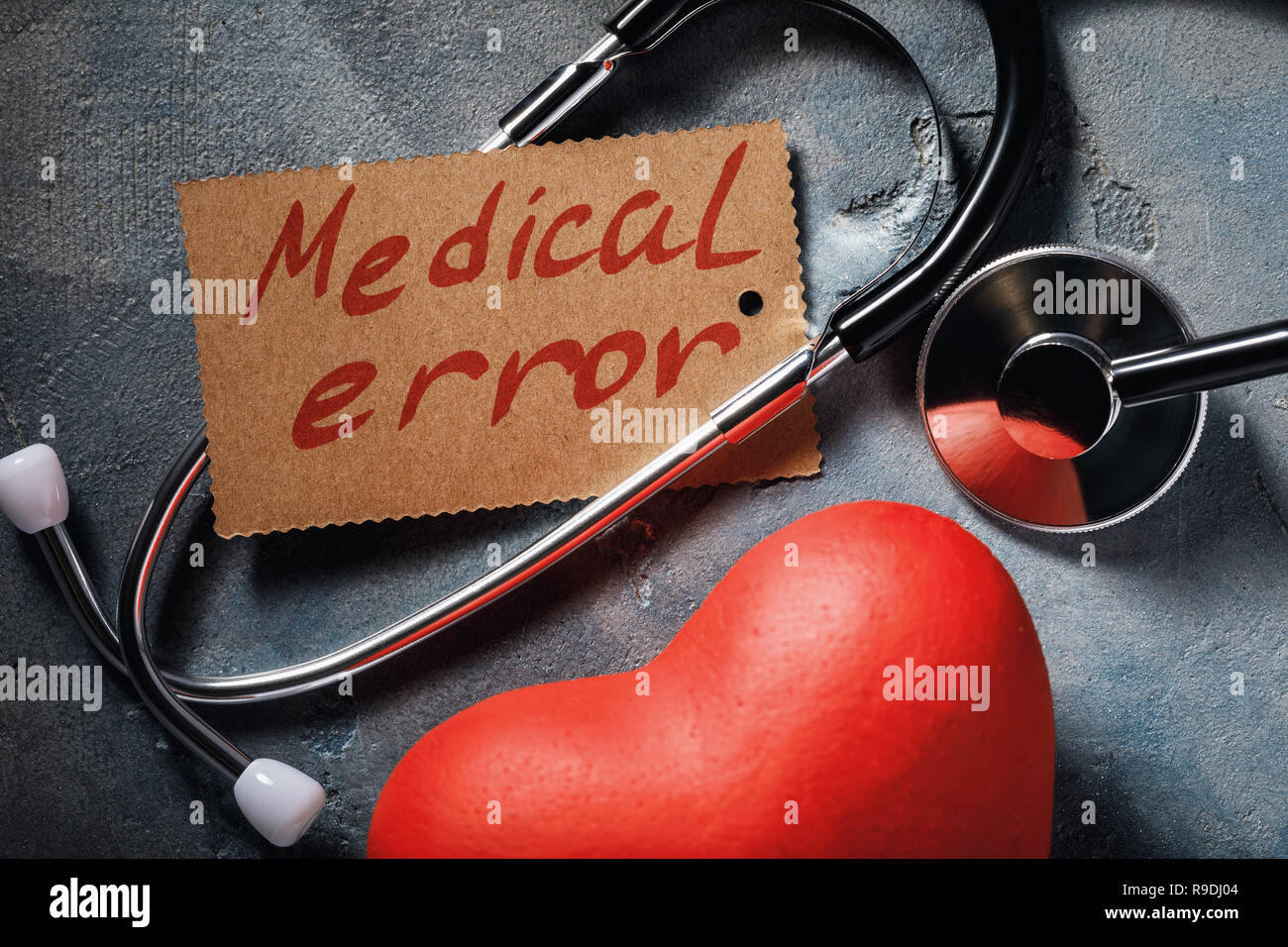 Medical error concept: stethoscope and heart shaped object, close-up ...