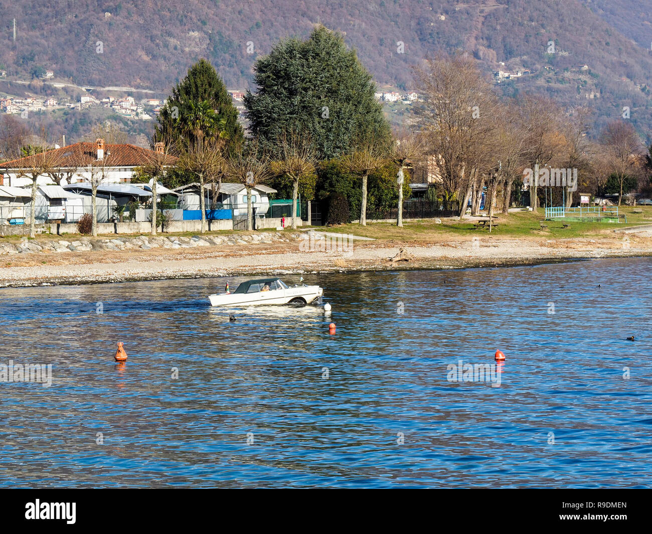 Dongo, Italy - December 22, 2018: Amphibious vehicle in navigation at ...