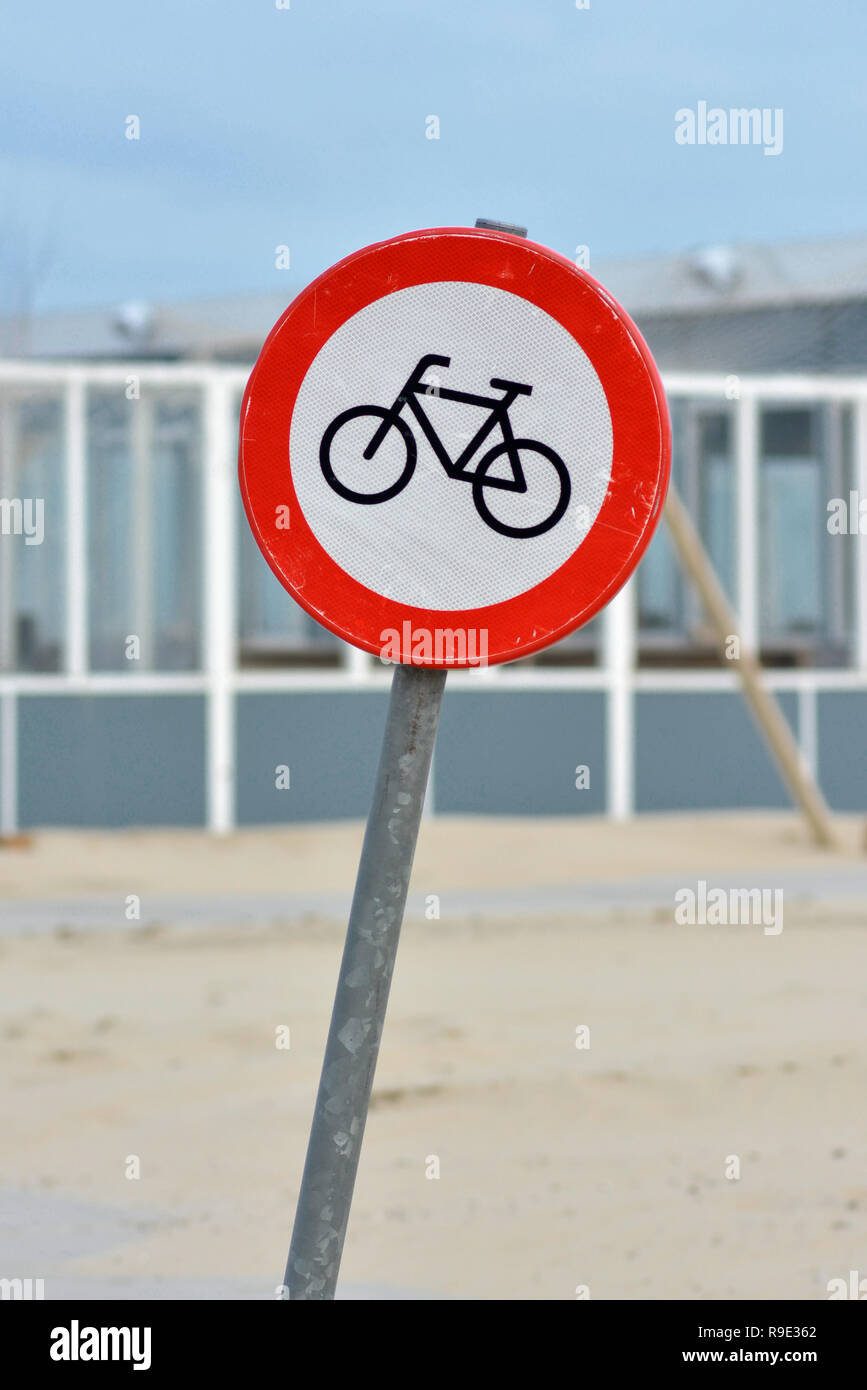 Red bicycle street warning sign on shore of Texel Stock Photo - Alamy