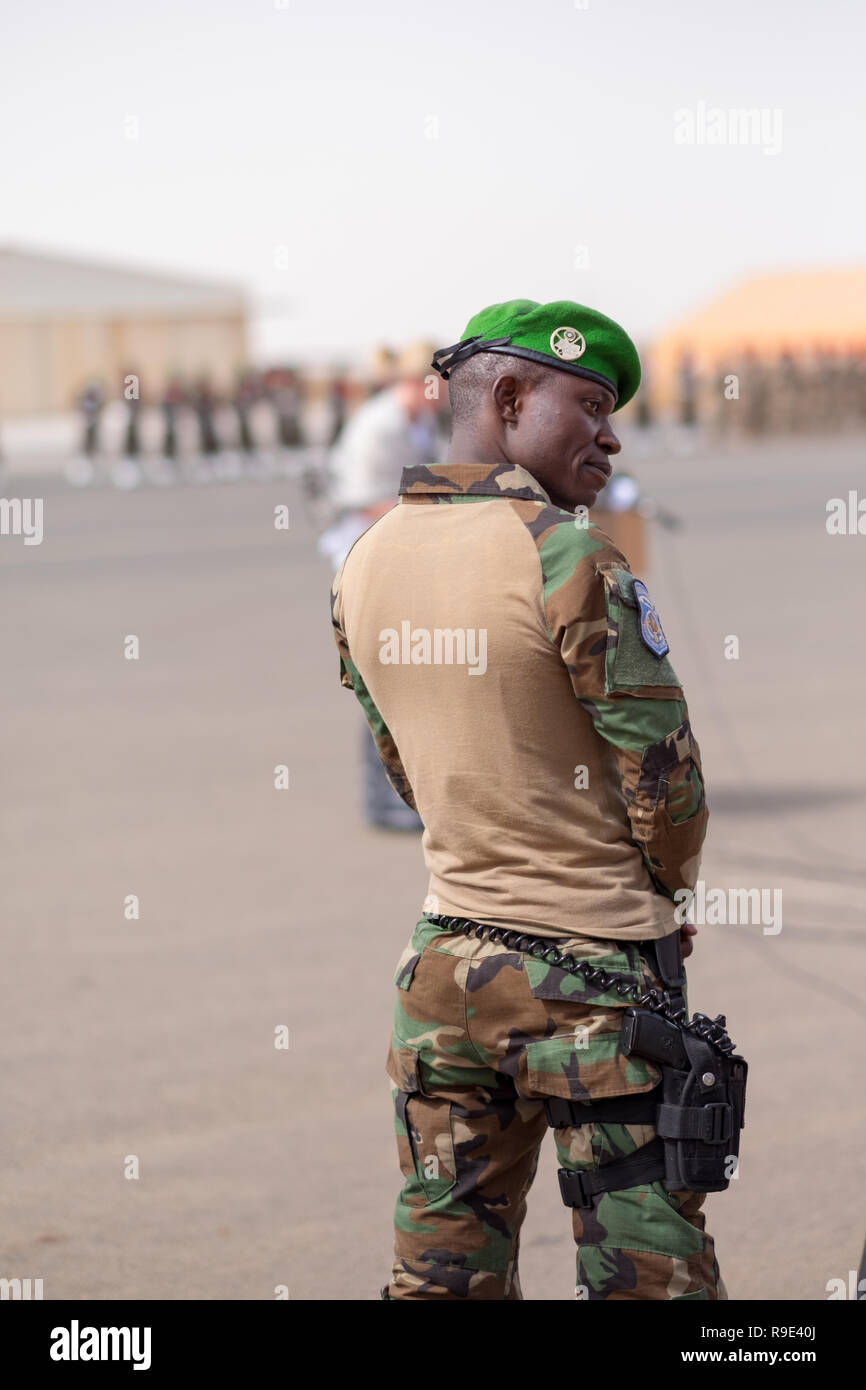 Niamey, Niger, 11 April 2018: A soldier from Niger stands guard at an ...
