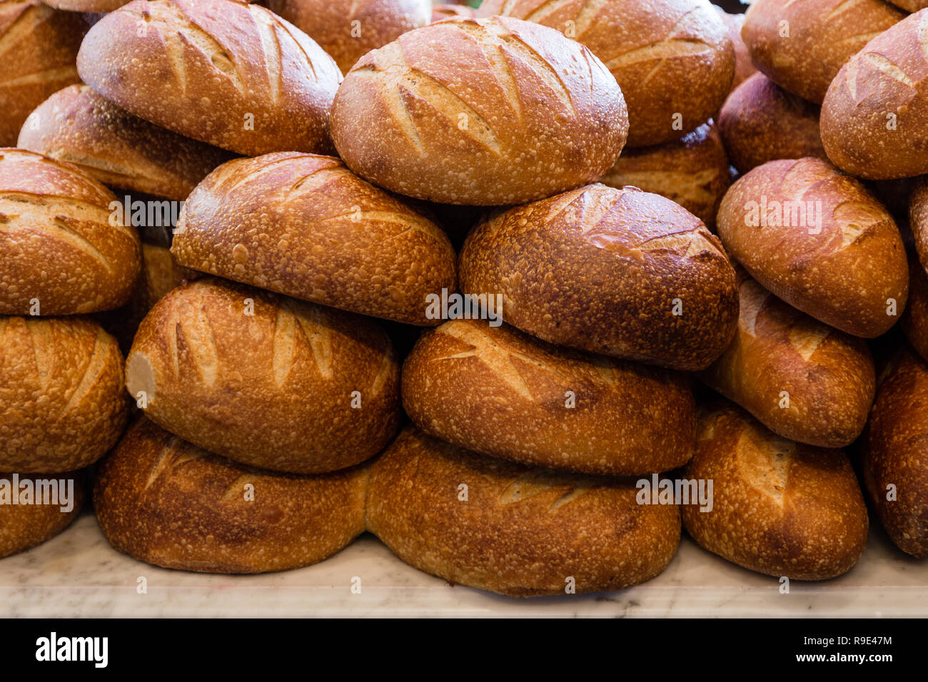 Fresh sourdough bread stacked in a bakery ready to sell and eat Stock ...