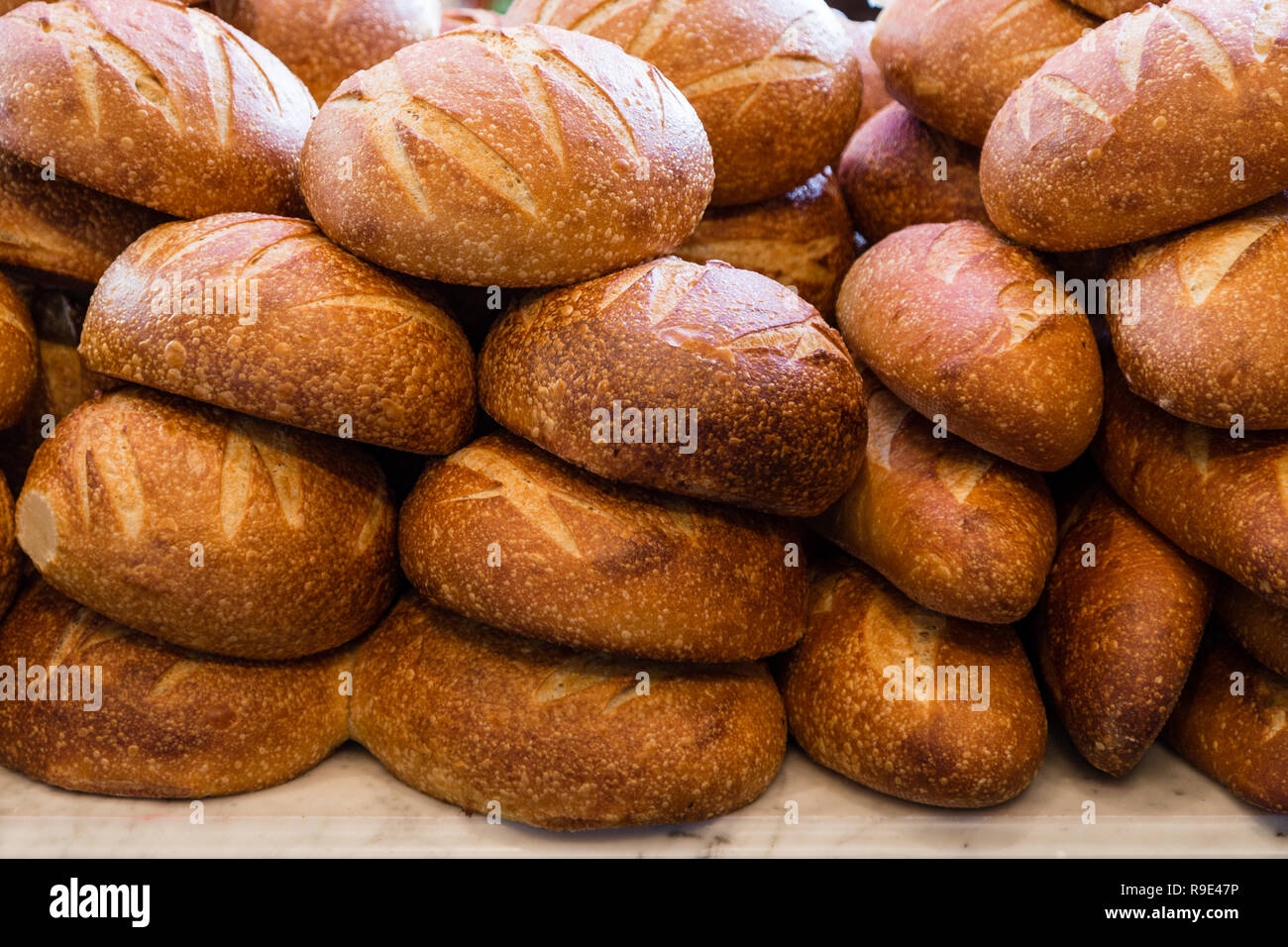 Fresh sourdough bread stacked in a bakery ready to sell and eat Stock ...