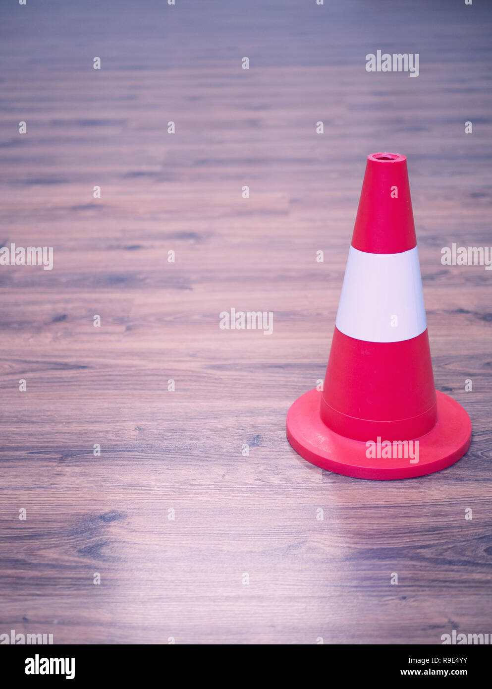 close-up of warning plastic cone indoor on a wooden floor Stock Photo ...