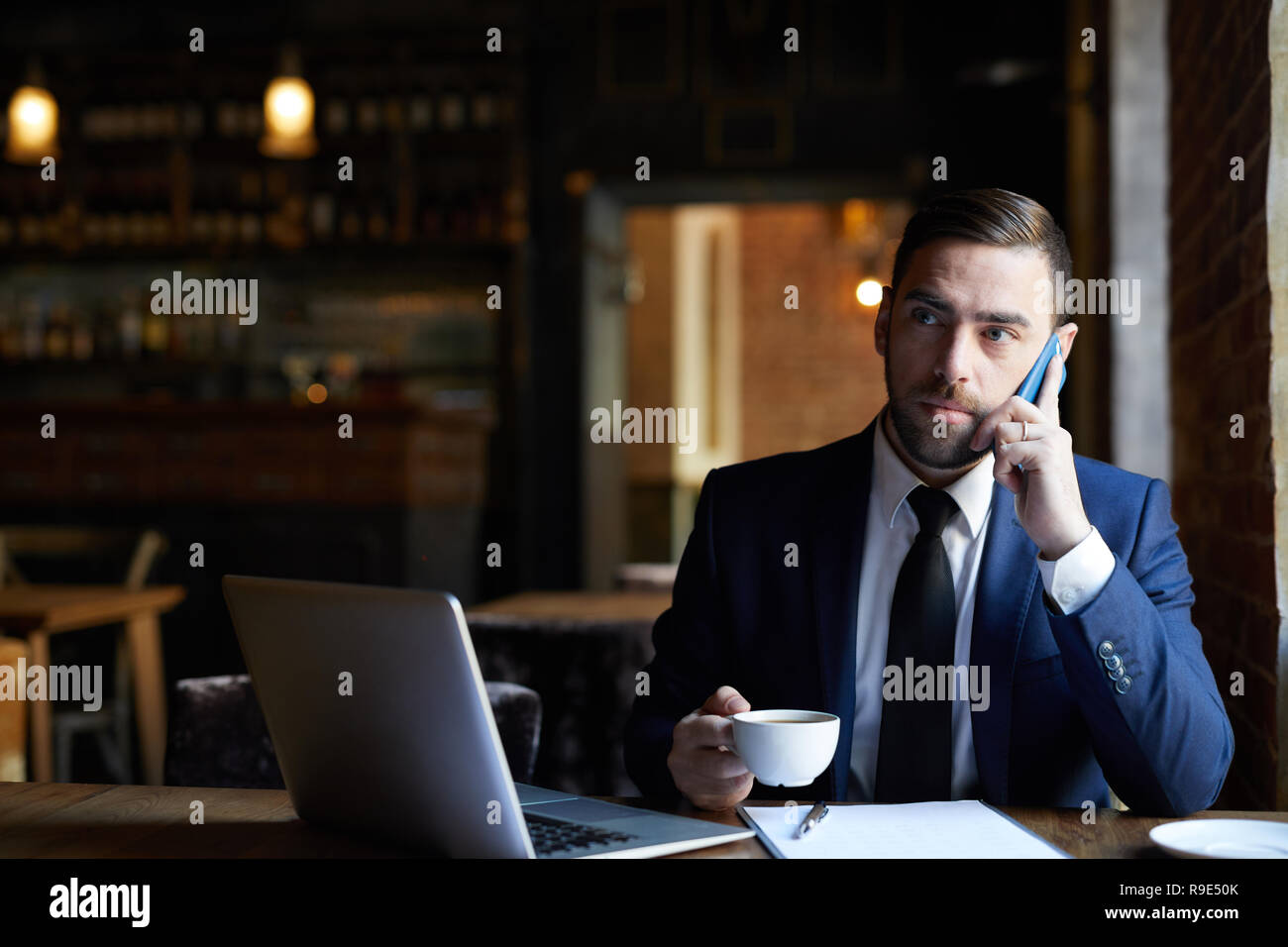 Young adult freelancer man talking hi-res stock photography and images ...