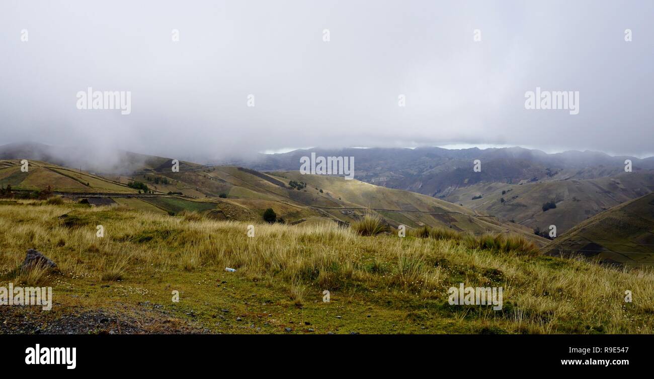 The heavy morning fog put a mysterious veil over the Andes mountains in ...