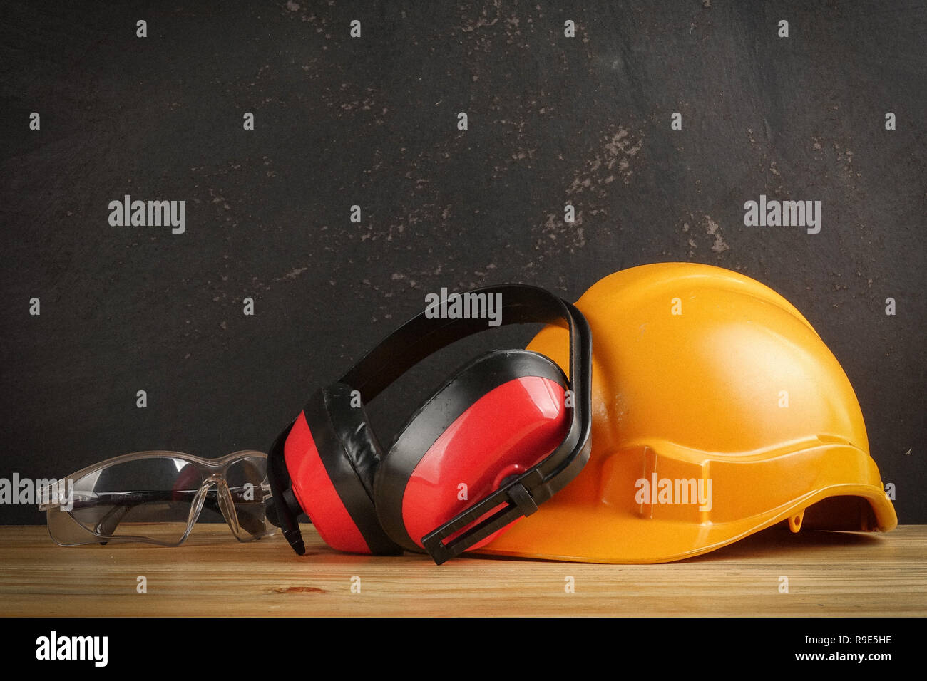 Safety Personal Protective Equipment(PPE) on a rustic black background ...