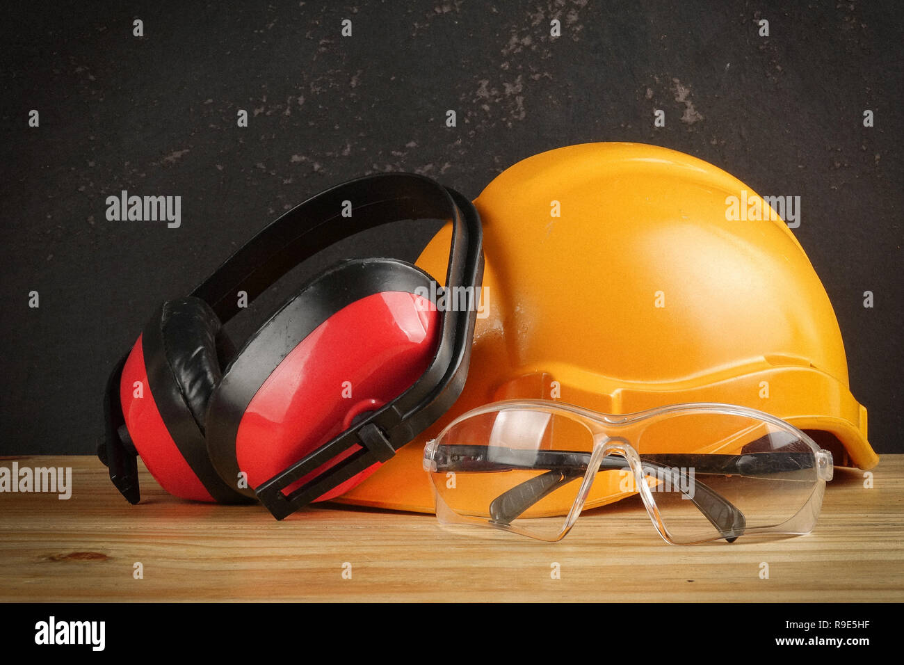 Safety Personal Protective Equipment(PPE) on a rustic black background ...