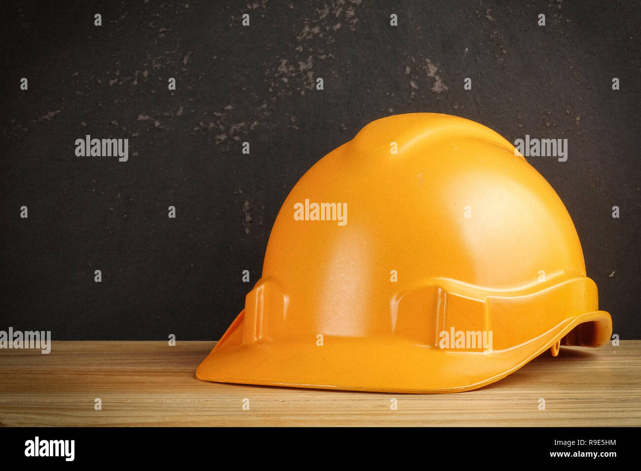 Safety Personal Protective Equipment(PPE) on a rustic black background ...