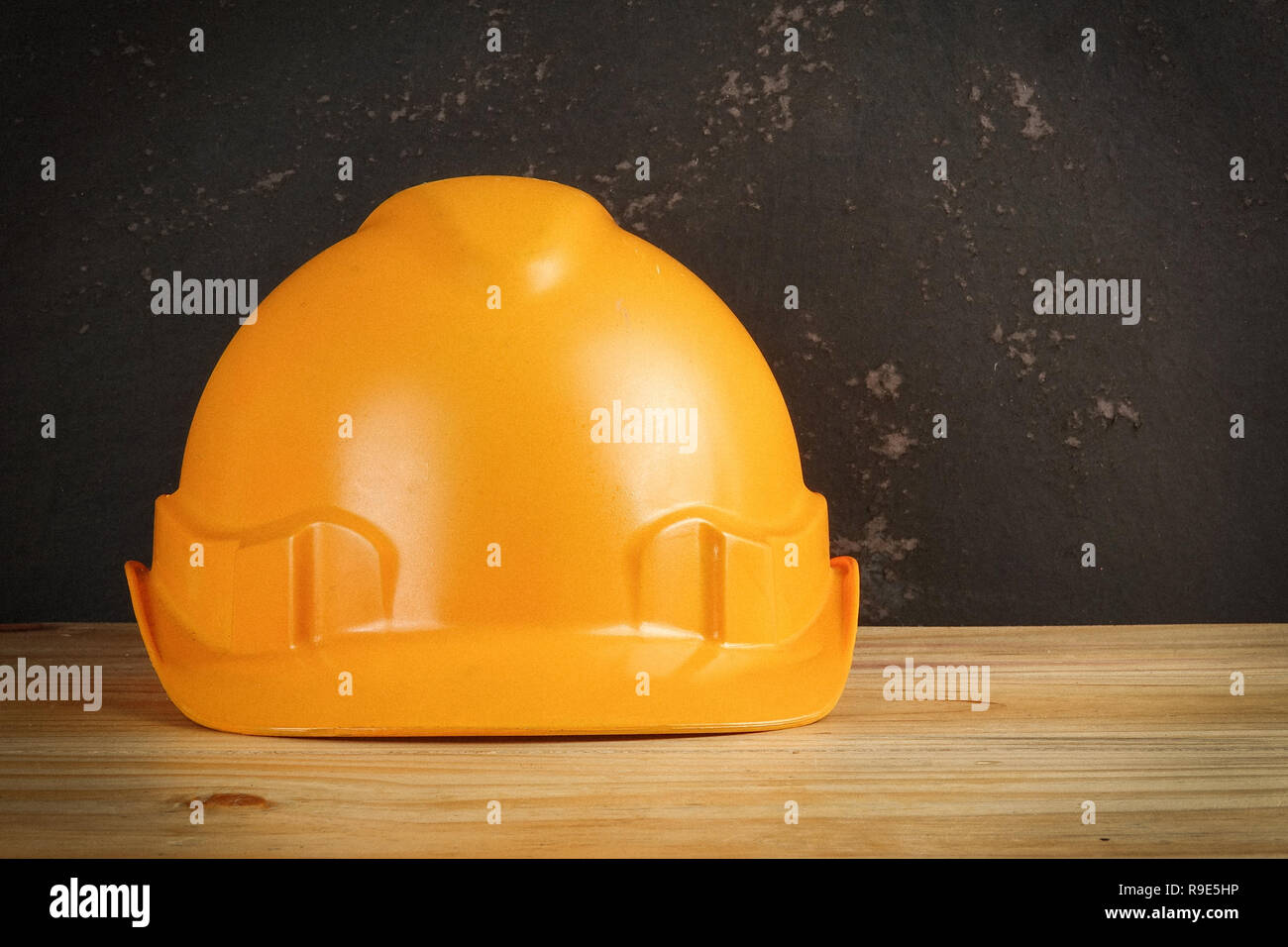 Safety Personal Protective Equipment(PPE) on a rustic black background ...