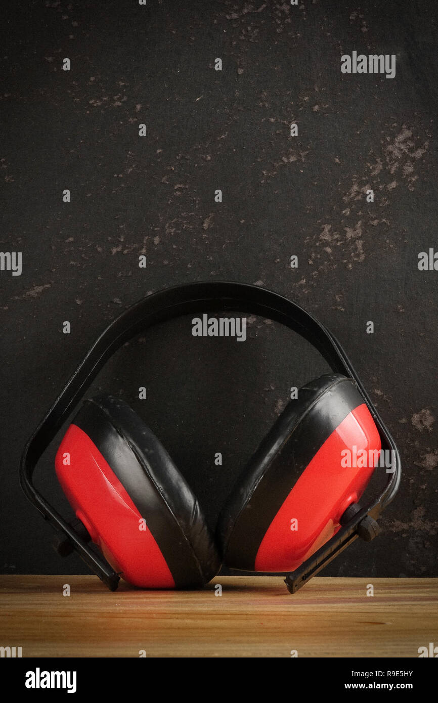 Safety Personal Protective Equipment(PPE) on a rustic black background ...