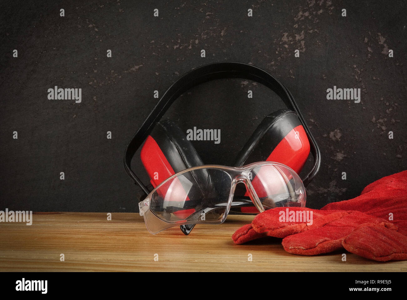 Safety Personal Protective Equipment(PPE) on a rustic black background ...