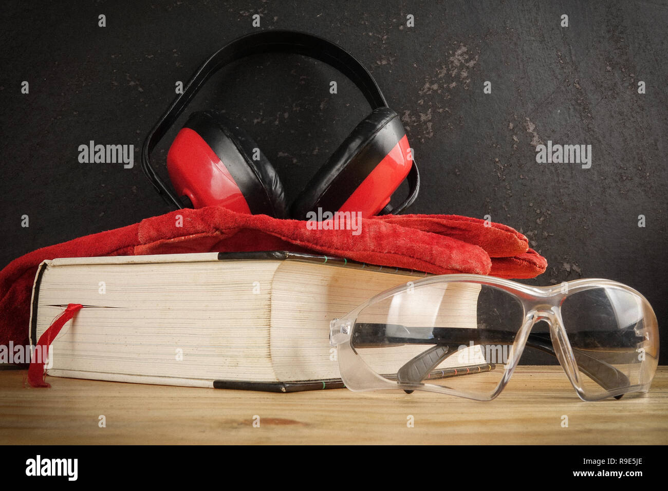 Safety Personal Protective Equipment(PPE) on a rustic black background ...