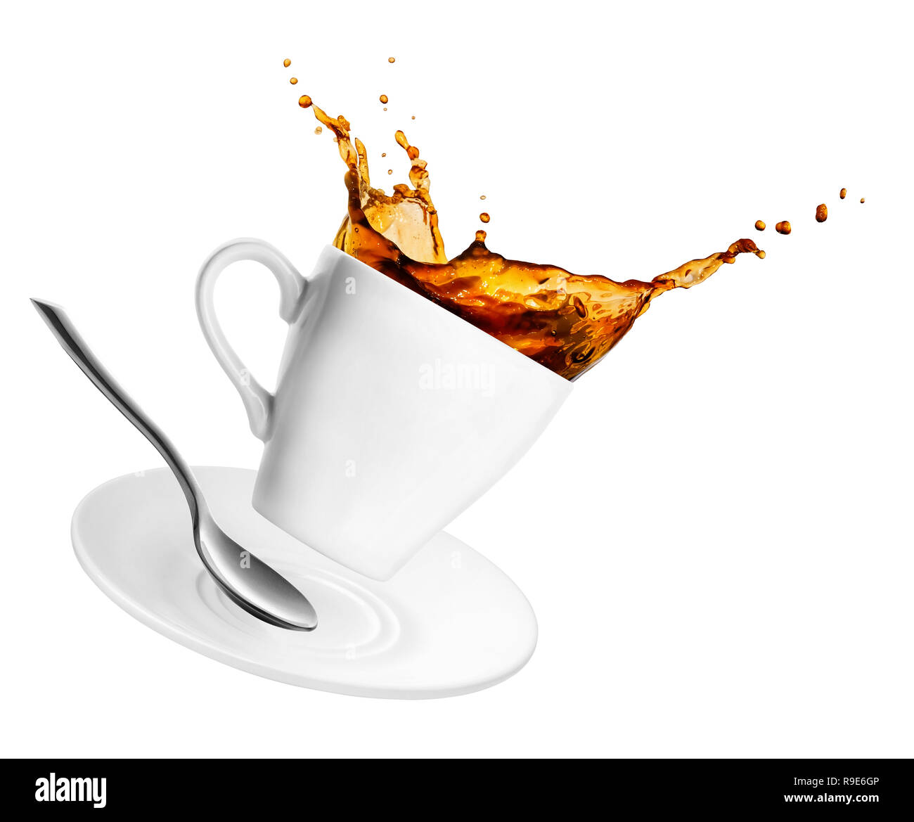 cup of spilling coffee with saucer and spoon isolated on white ...