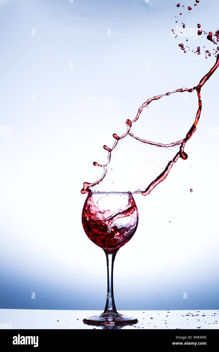 Wine splashing in glass, acrylic background, studio lighting Stock ...