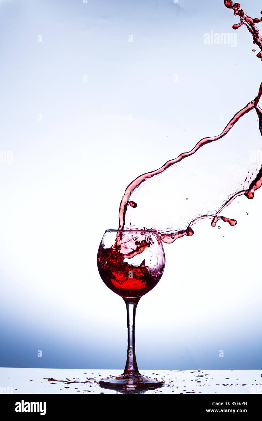 Wine splashing in glass, acrylic background, studio lighting Stock ...