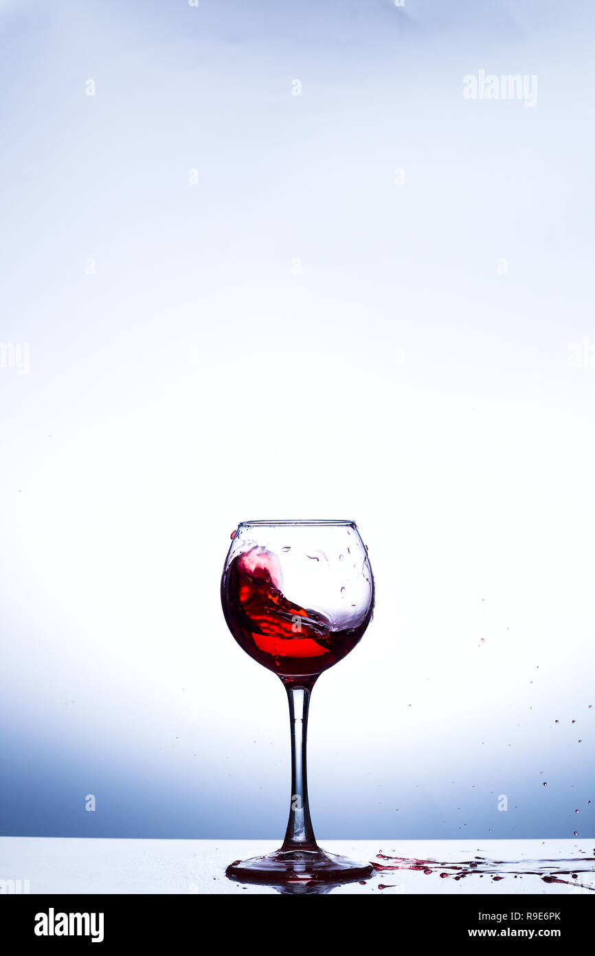 Wine splashing in glass, acrylic background, studio lighting Stock ...