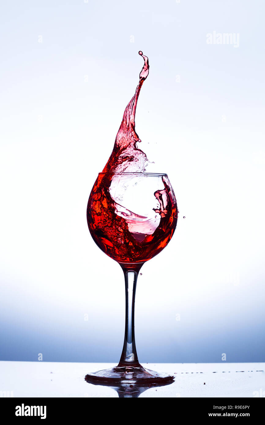 Wine splashing in glass, acrylic background, studio lighting Stock ...